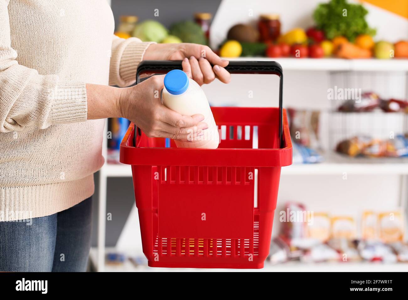 Woman buying milk in hi-res stock photography and images - Alamy