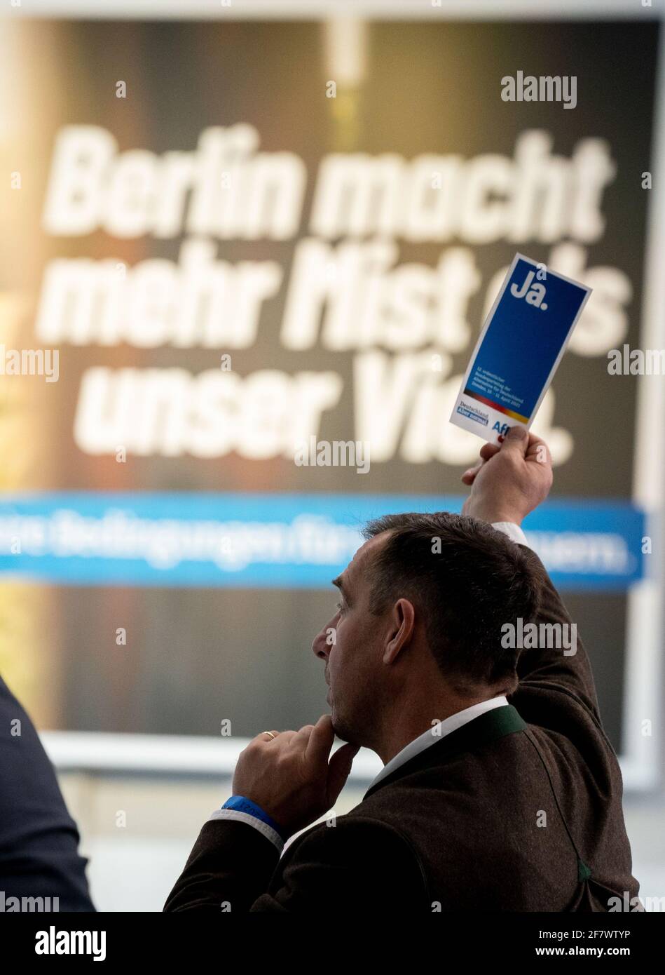 Dresden, Germany. 10th Apr, 2021. Delegates show their voting cards at ...