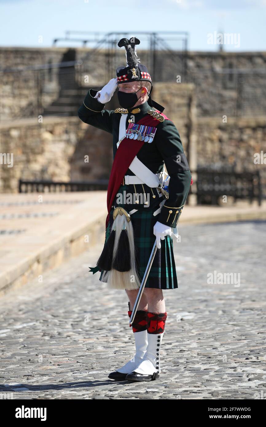 Lieutenant Colonel Hugo Clark salutes before members of the 105th ...