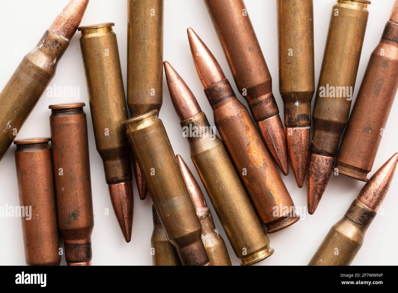 A group of bullet ammunition shells on a white background Stock Photo ...