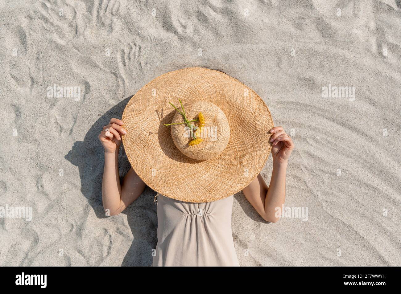Portrait woman lying on sand hi-res stock photography and images - Alamy