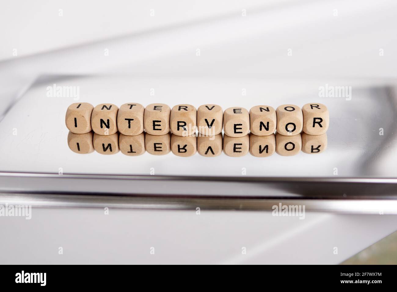Word intervenor made by wooden cubes Stock Photo - Alamy
