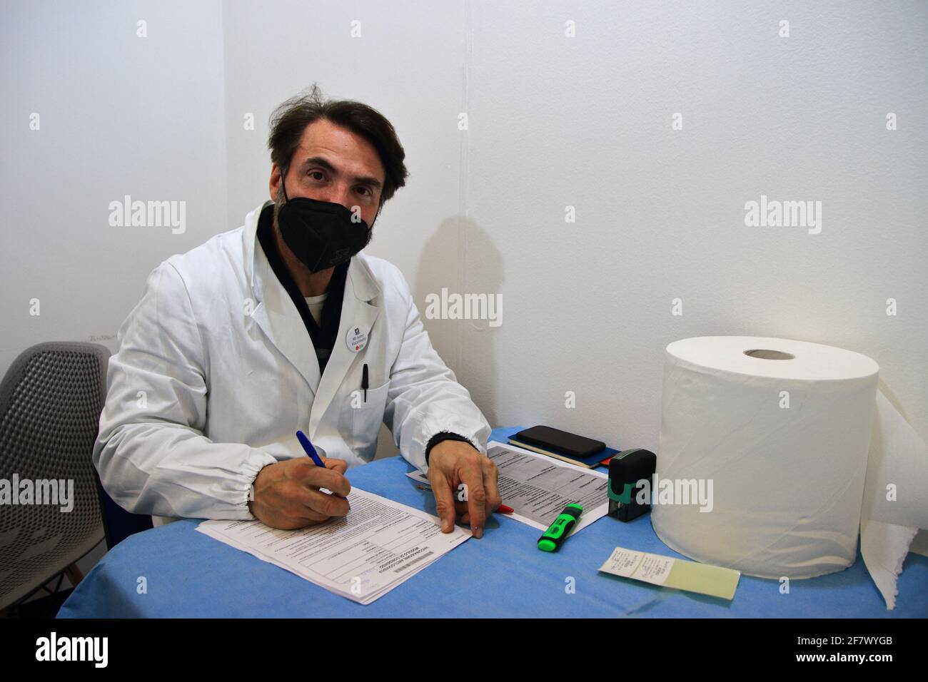 Doctor in one of the many boxes for the administration of vaccines ...