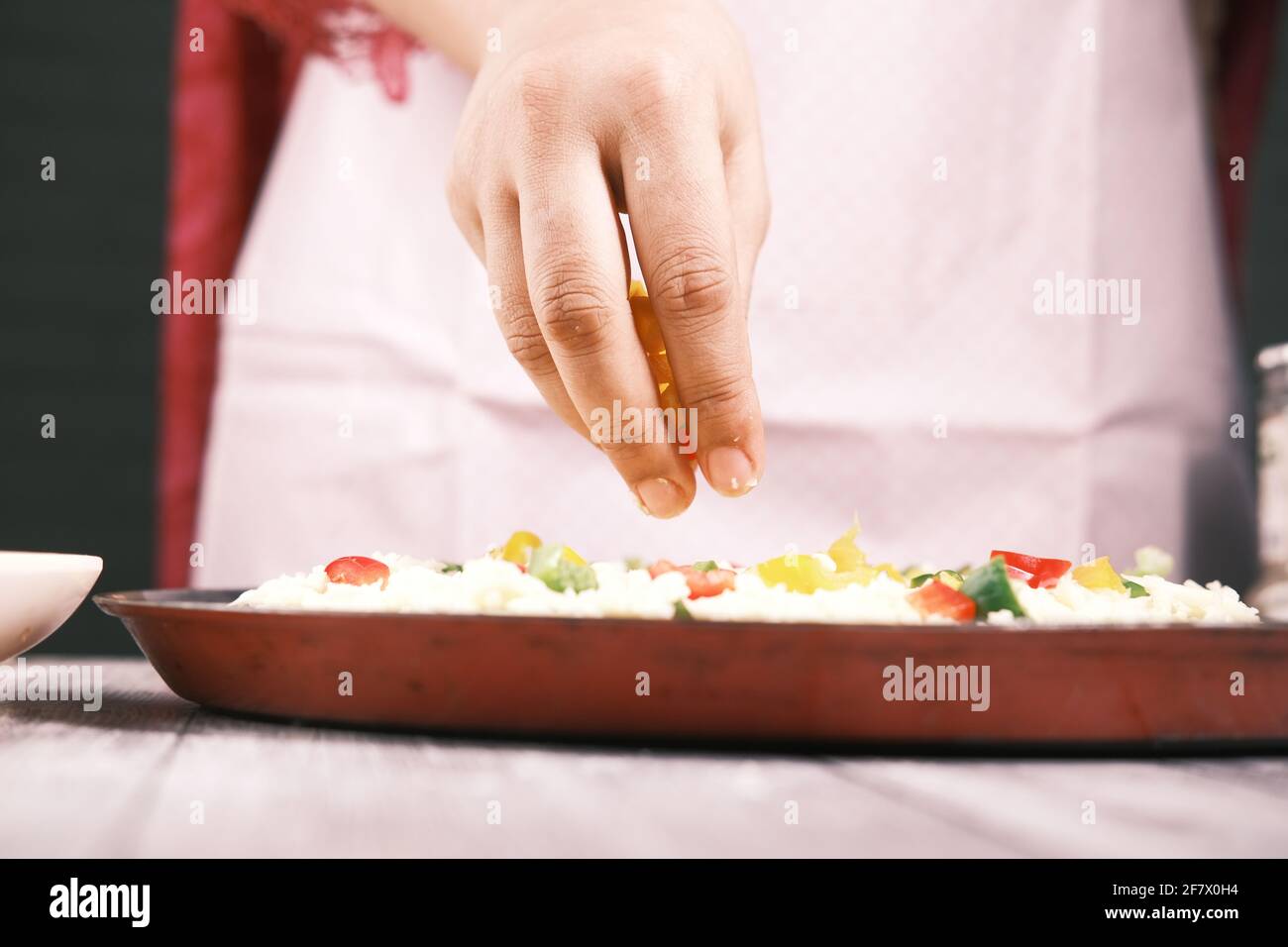 Putting cheese on pizza hi-res stock photography and images - Alamy