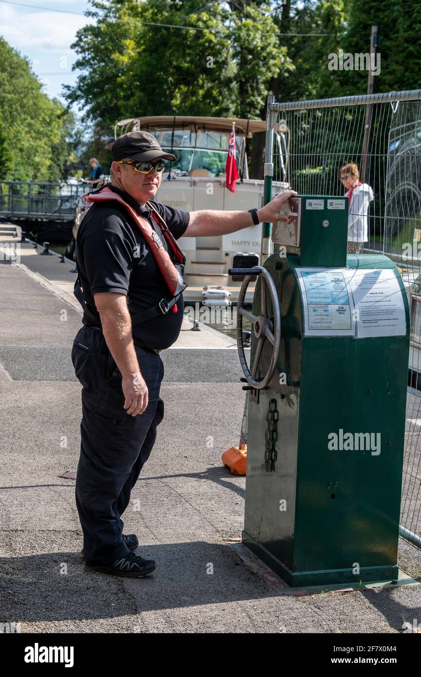An 'On duty' lock keeper controlling the gates as the last boat enters ...