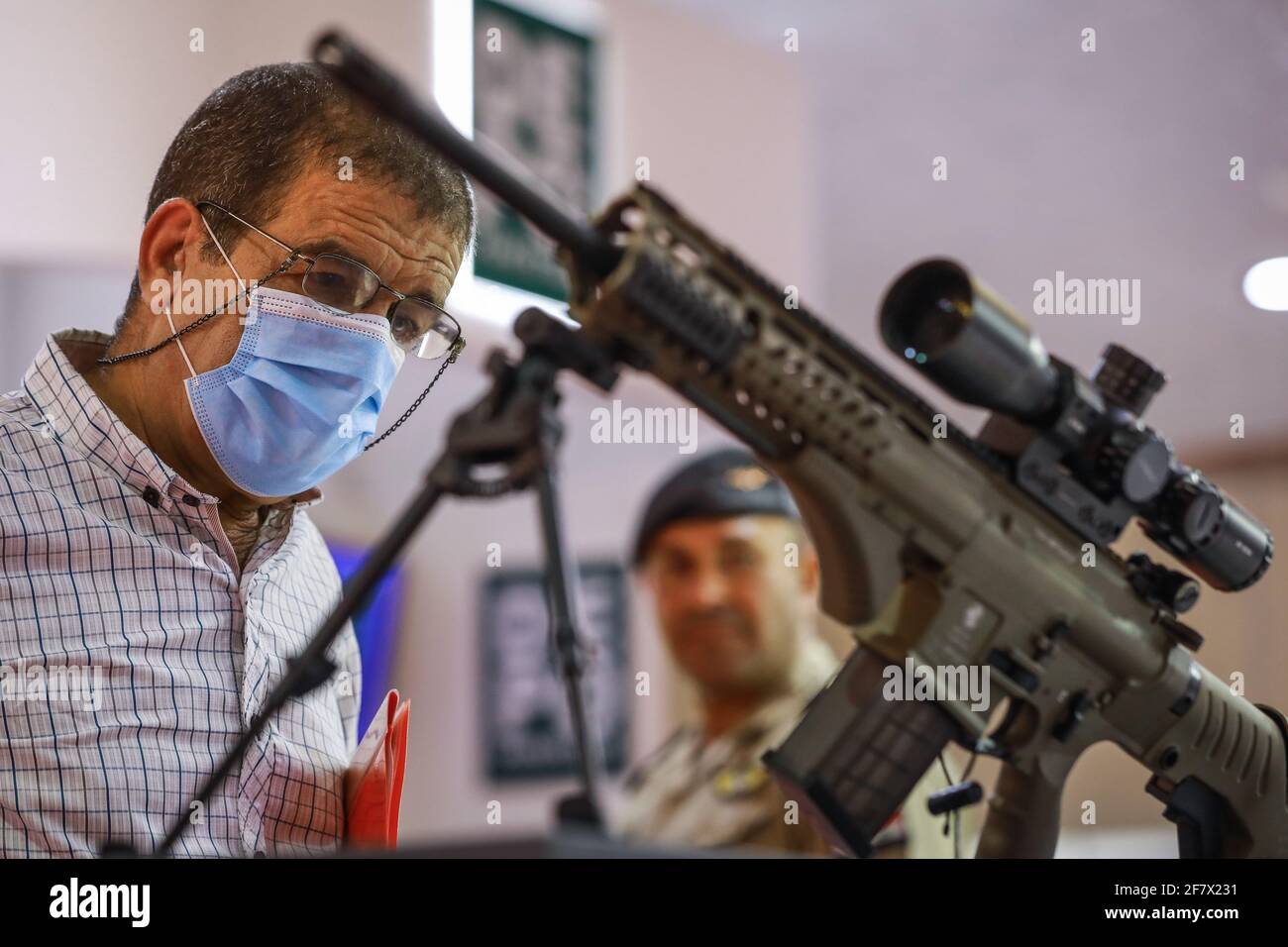 Baghdad, Iraq. 10th Apr, 2021. A visitor inspects a marksman rifle on ...