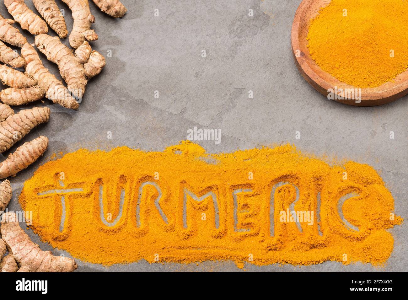 Turmeric powder and fresh turmeric - Top view Stock Photo - Alamy