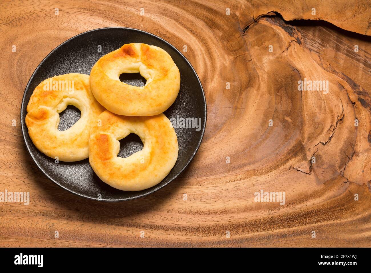Pandequeso traditional Colombian food. Wood table Stock Photo - Alamy
