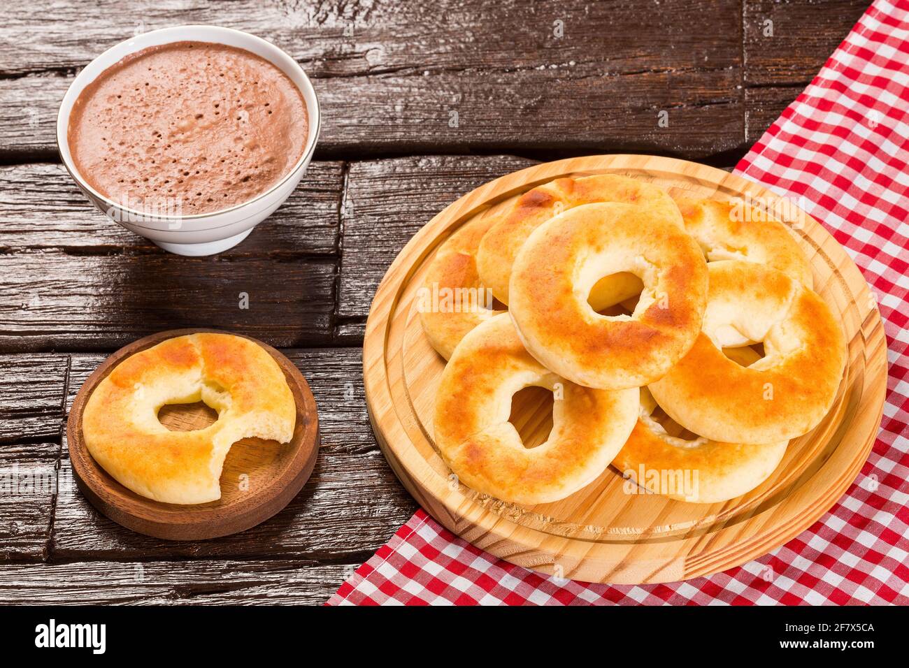 Pandequeso traditional Colombian food - Hot drink chocolate. Wood ...