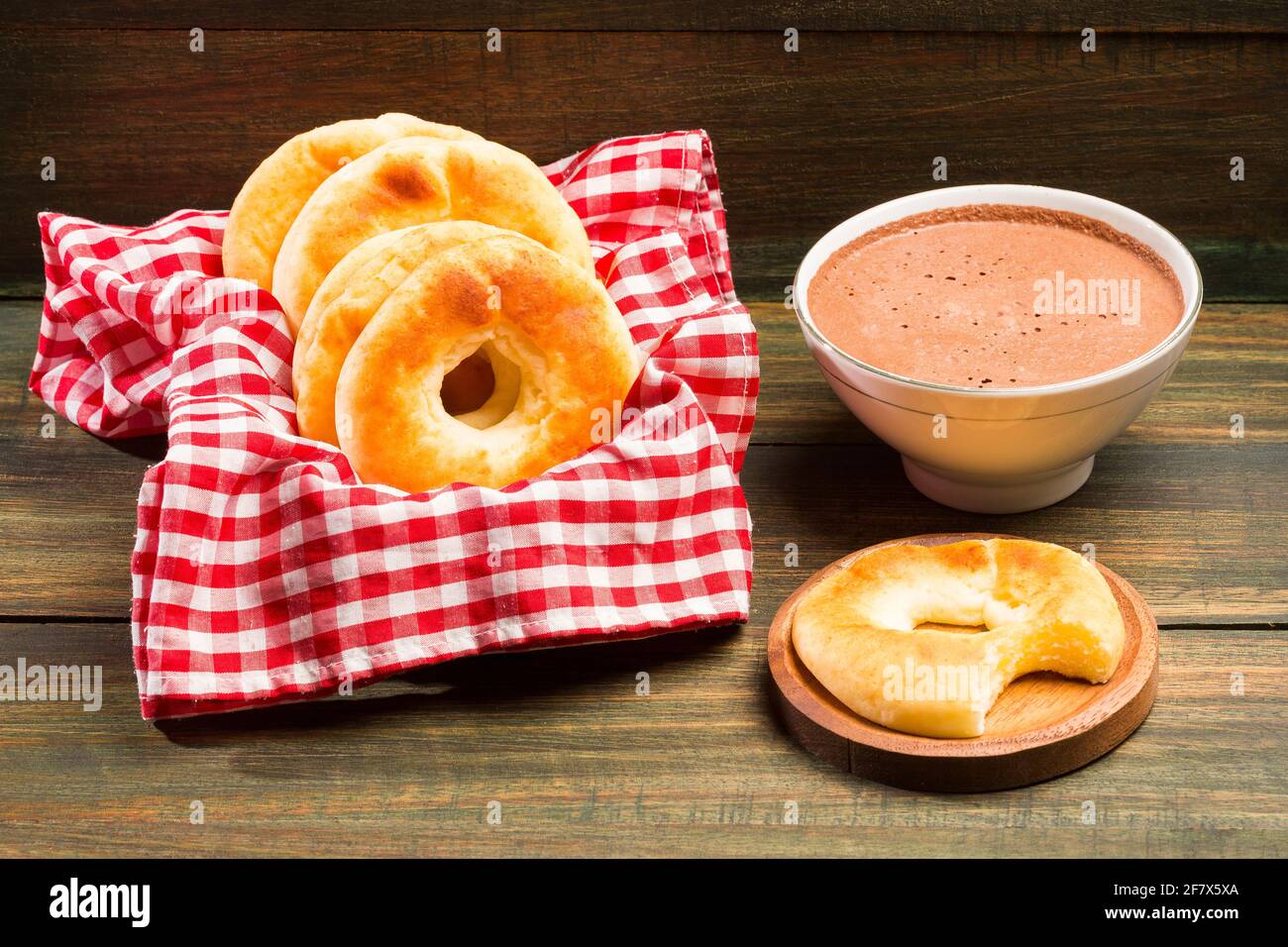 Pandequeso traditional Colombian food - Hot drink chocolate. Wood ...