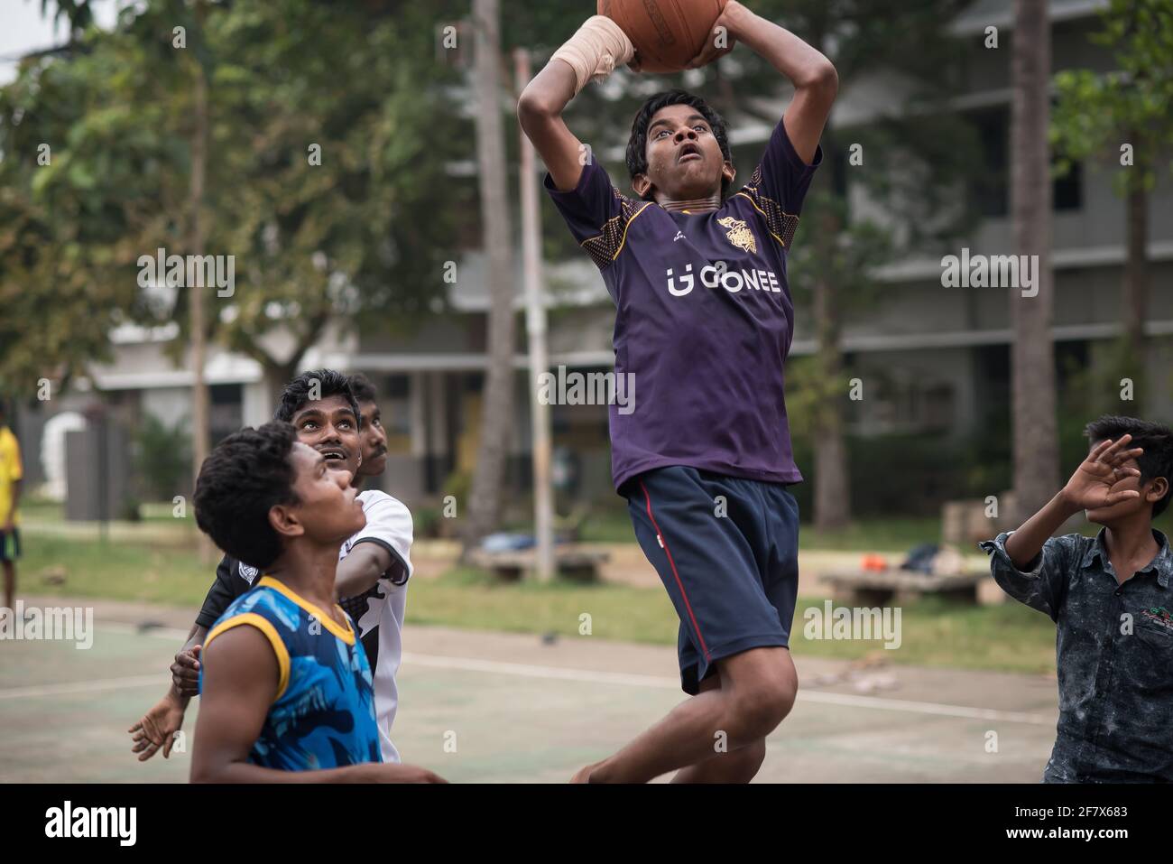 Indian boy playing basketball hi-res stock photography and images - Alamy