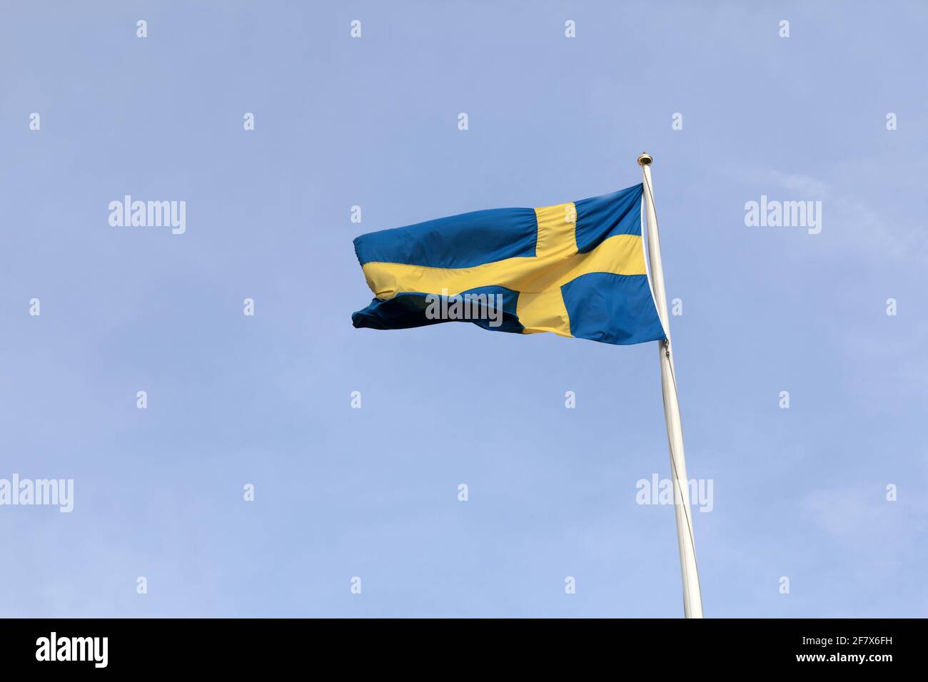 Waving flag of Sweden on the sky background Stock Photo - Alamy