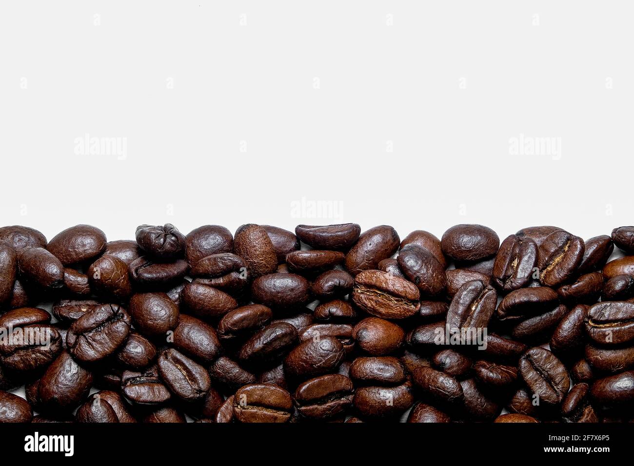 coffee in beans on a white background Stock Photo - Alamy