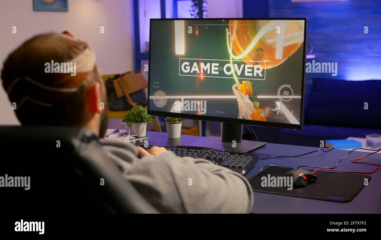 Game over for upset gamer playing on powerful computer first person ...