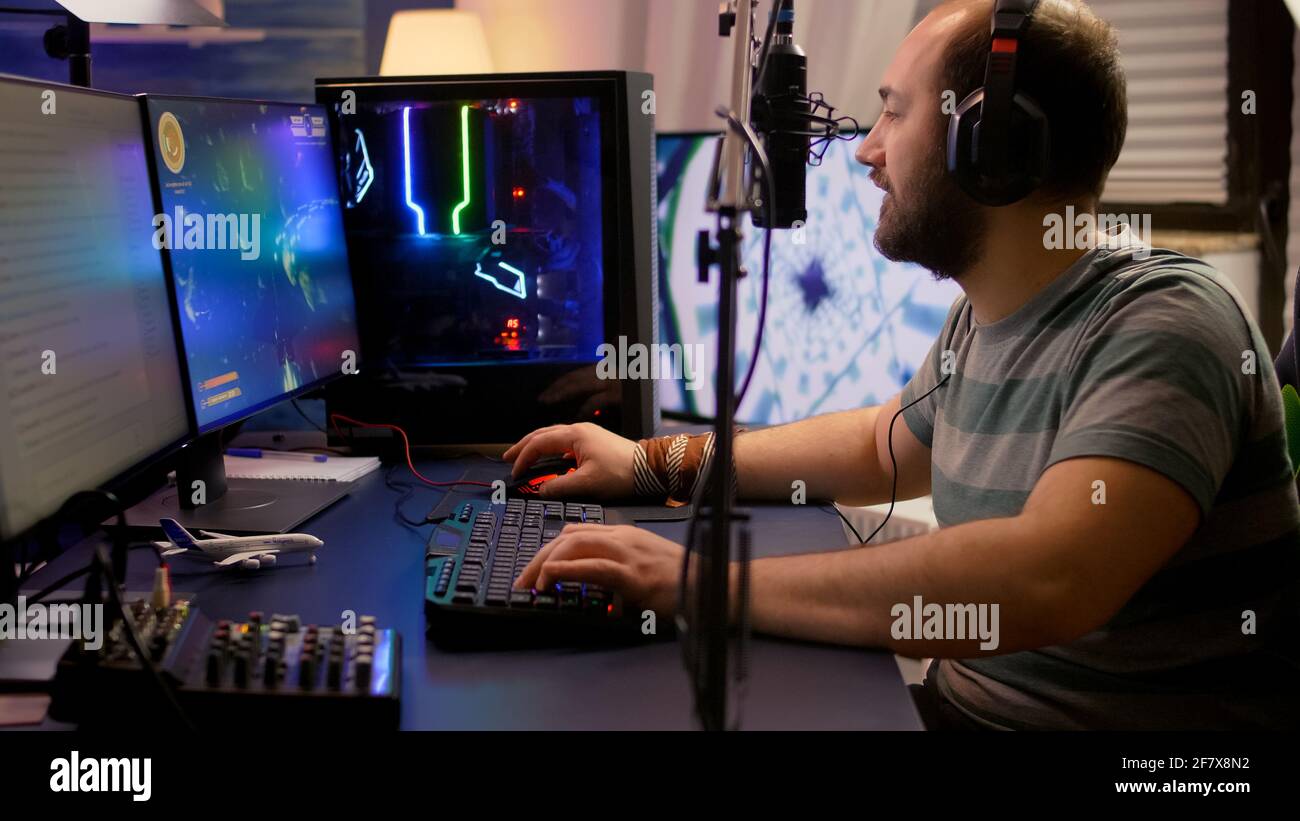 Pro gamer move the buttons on professional mixer late at night in ...