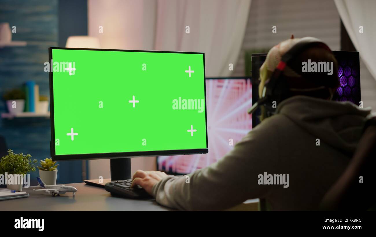 Professional cyber gamer playing video games with greenscreen, chroma ...