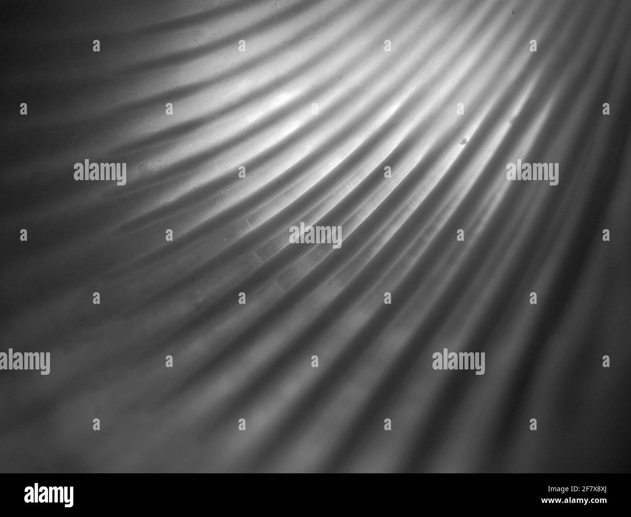 Grayscale shot of a sheet of steel with flutings Stock Photo - Alamy