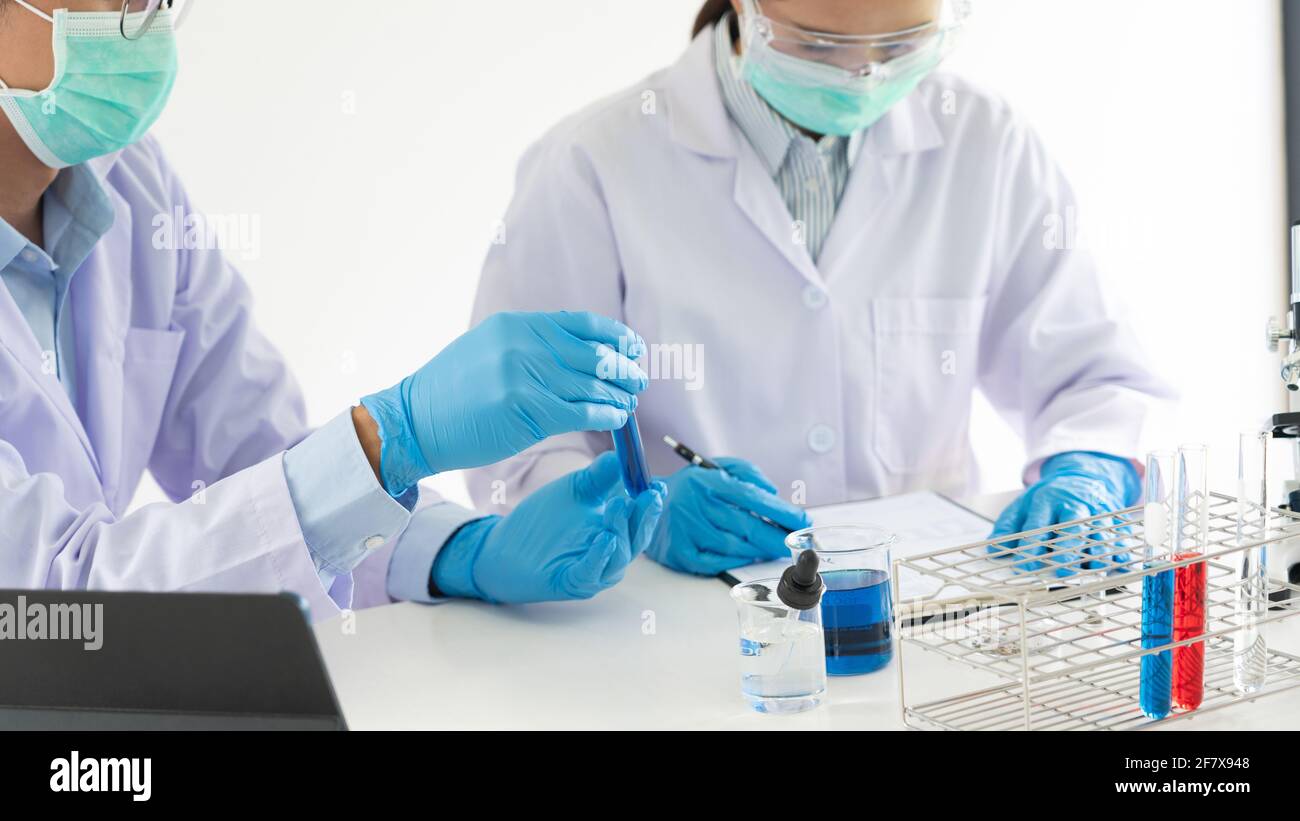 Team of Medical Research Scientists or researcher in lab coat testing ...