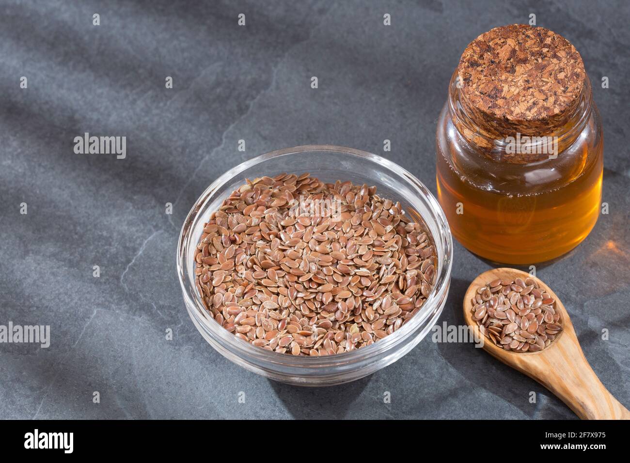Linseed oil and flax seeds - Linum usitatissimum Stock Photo - Alamy