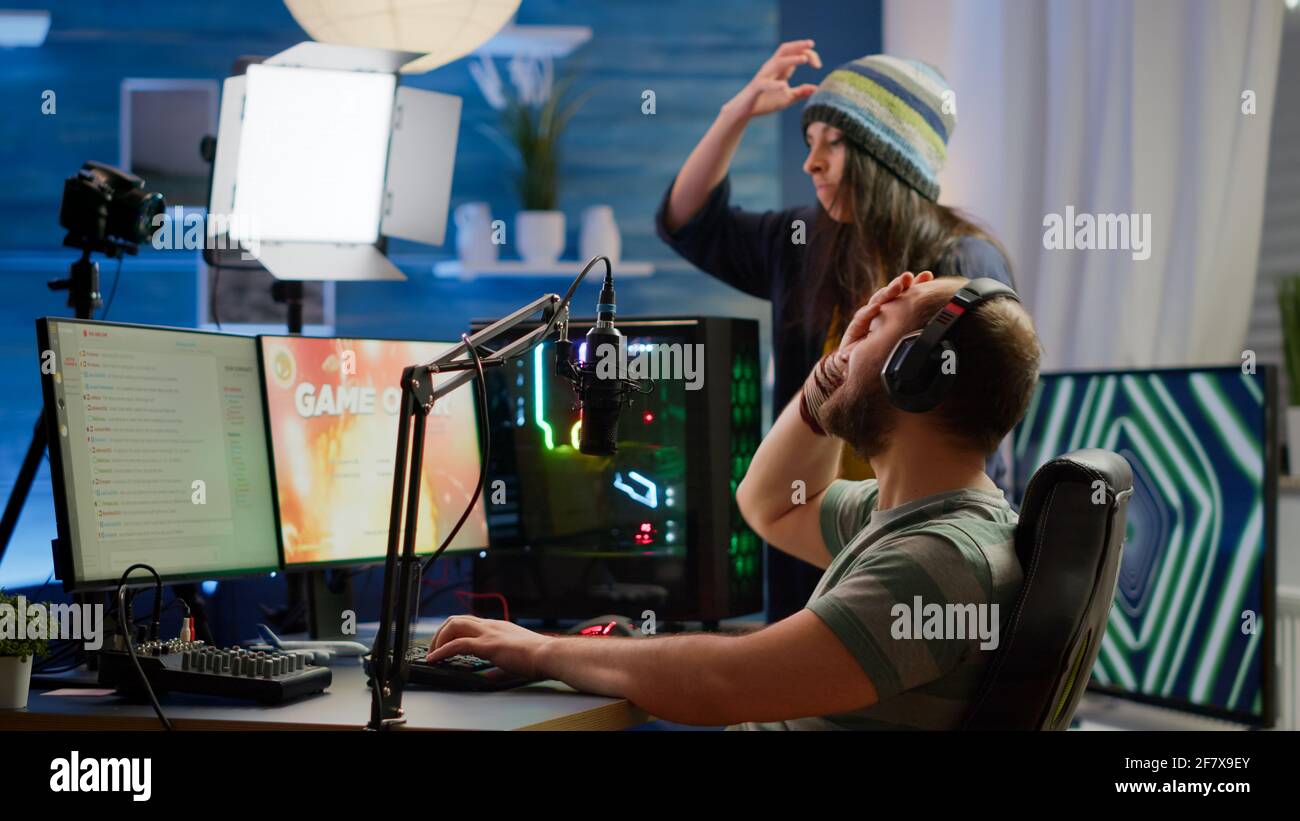 Nervous players couple losing online videogames competition using ...