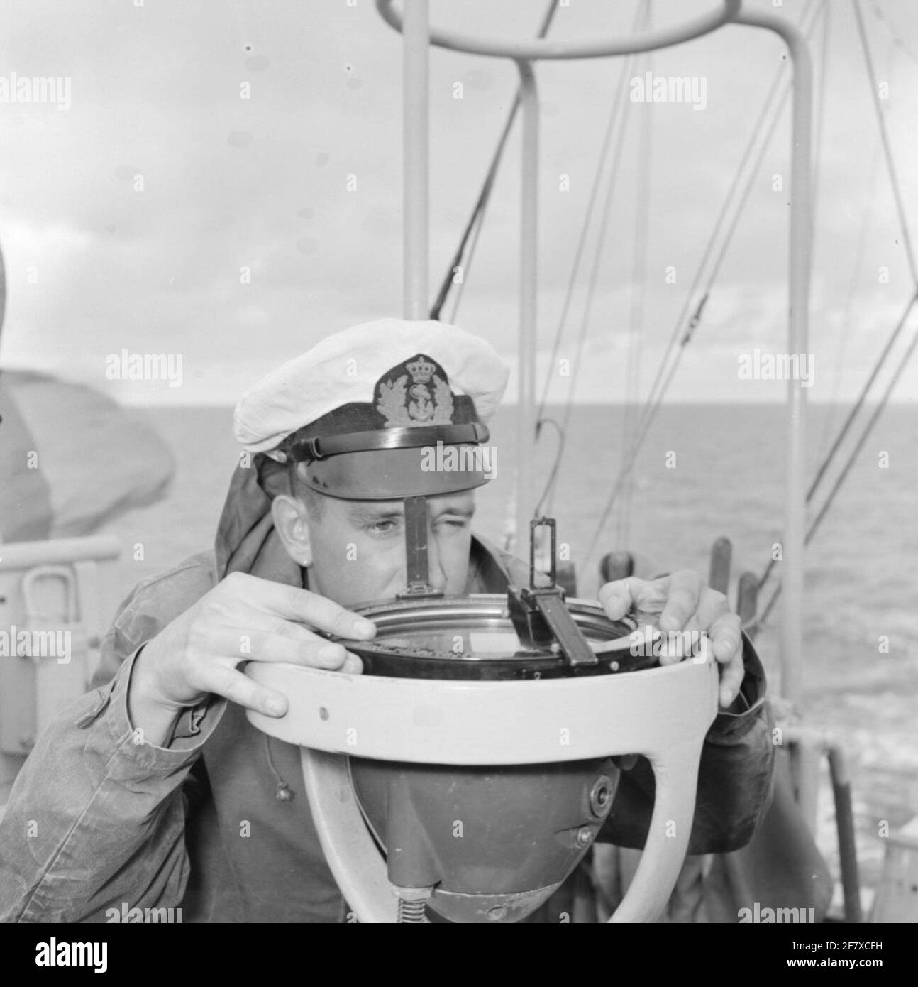 Officer aboard a mine sweeper takes a poll Stock Photo - Alamy