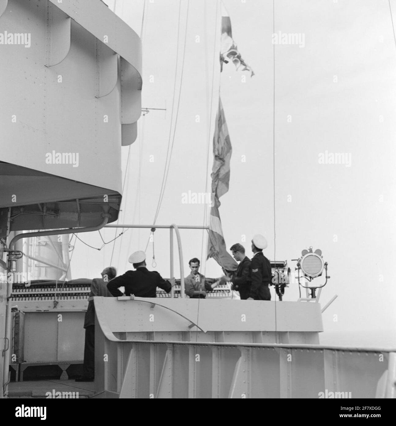 Work (signal flags hoist) of crew members recorded while making a ...