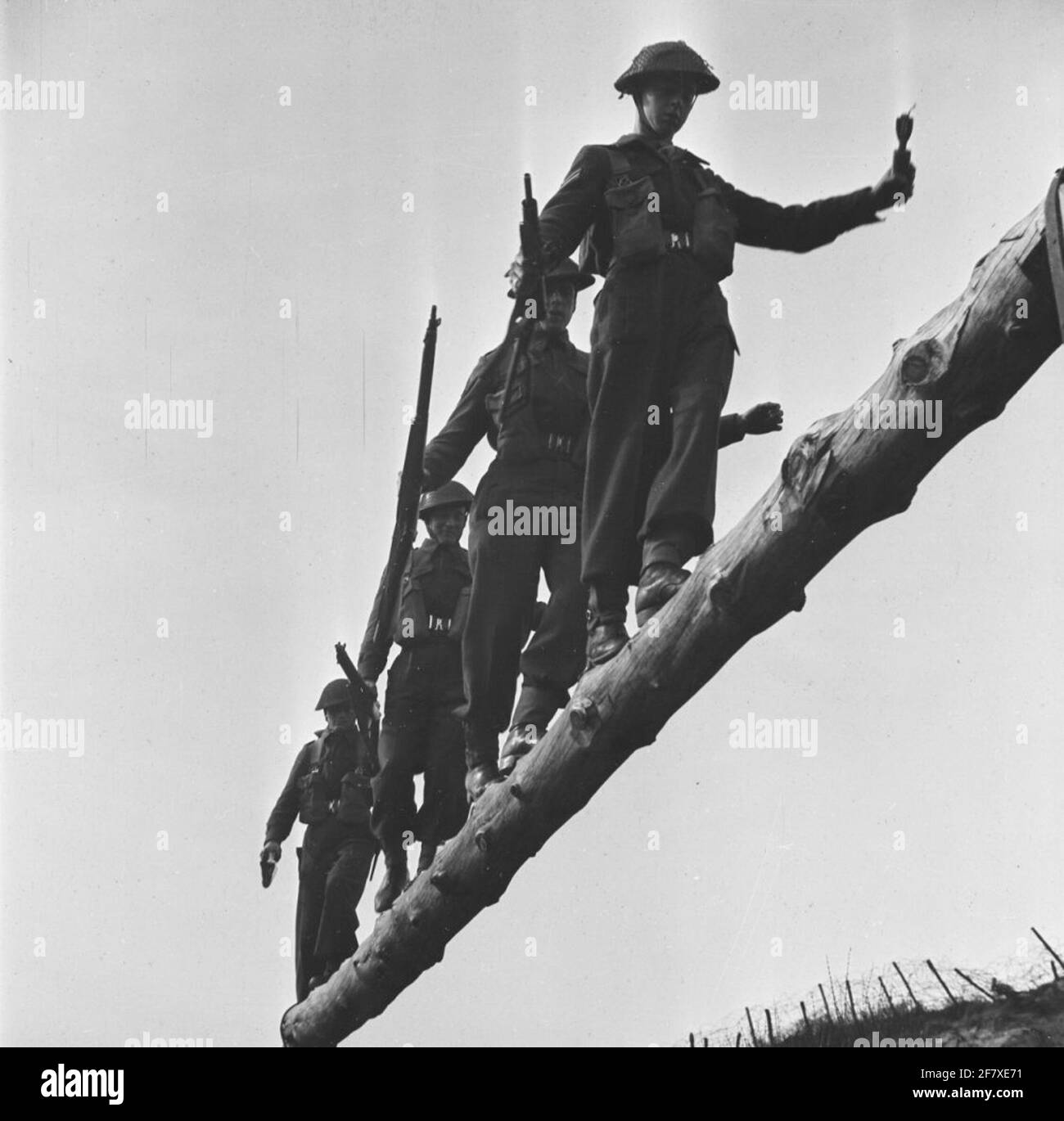 On the obstacle course over the balance beam Stock Photo - Alamy