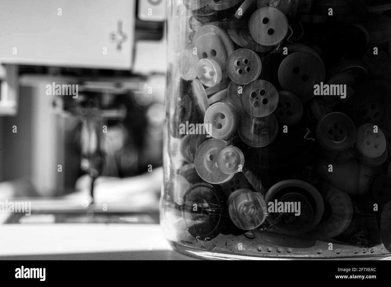 various types of buttons stored in a glass container Stock Photo - Alamy
