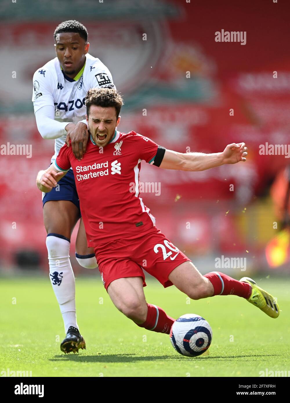 Aston Villa's Ezri Konsa (left) pulls back on Liverpool's Diogo Jota ...