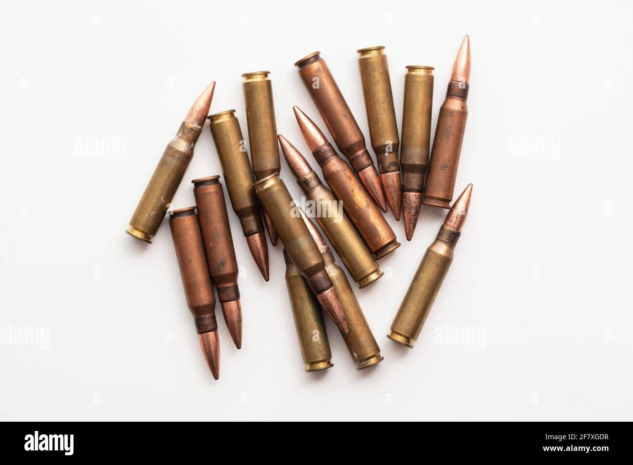 A group of bullet ammunition shells on a white background Stock Photo ...