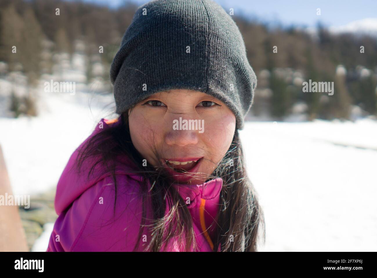 freezing Winter holidays - young happy and beautiful Asian Korean woman ...