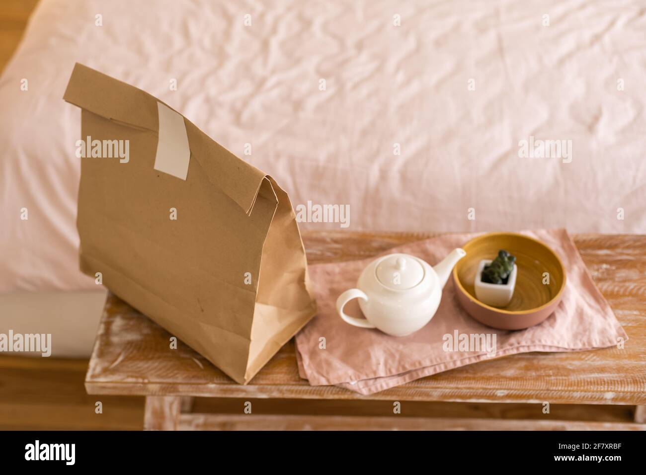 Paper packages with groceries on kitchen table Stock Photo - Alamy