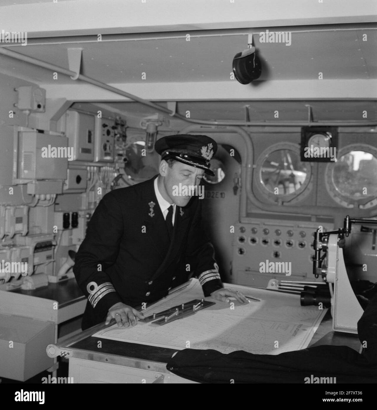 The commander of the submarine hunter Hr.Ms. Amsterdam (D 819) Captain ...