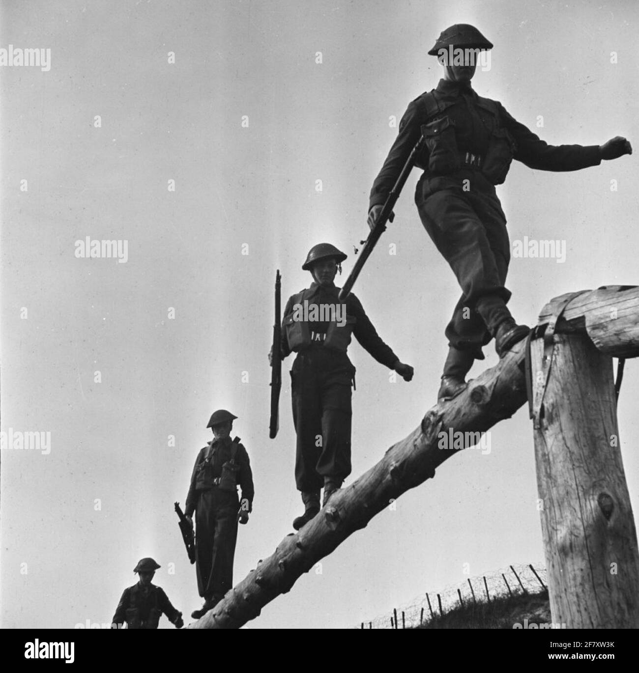 On the obstacle course over the balance beam Stock Photo - Alamy