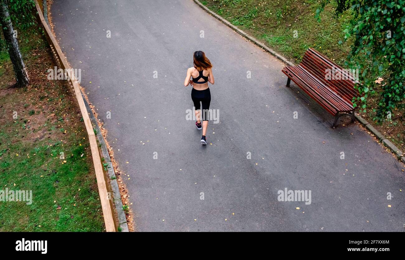 Aerial view of female runner backwards Stock Photo - Alamy
