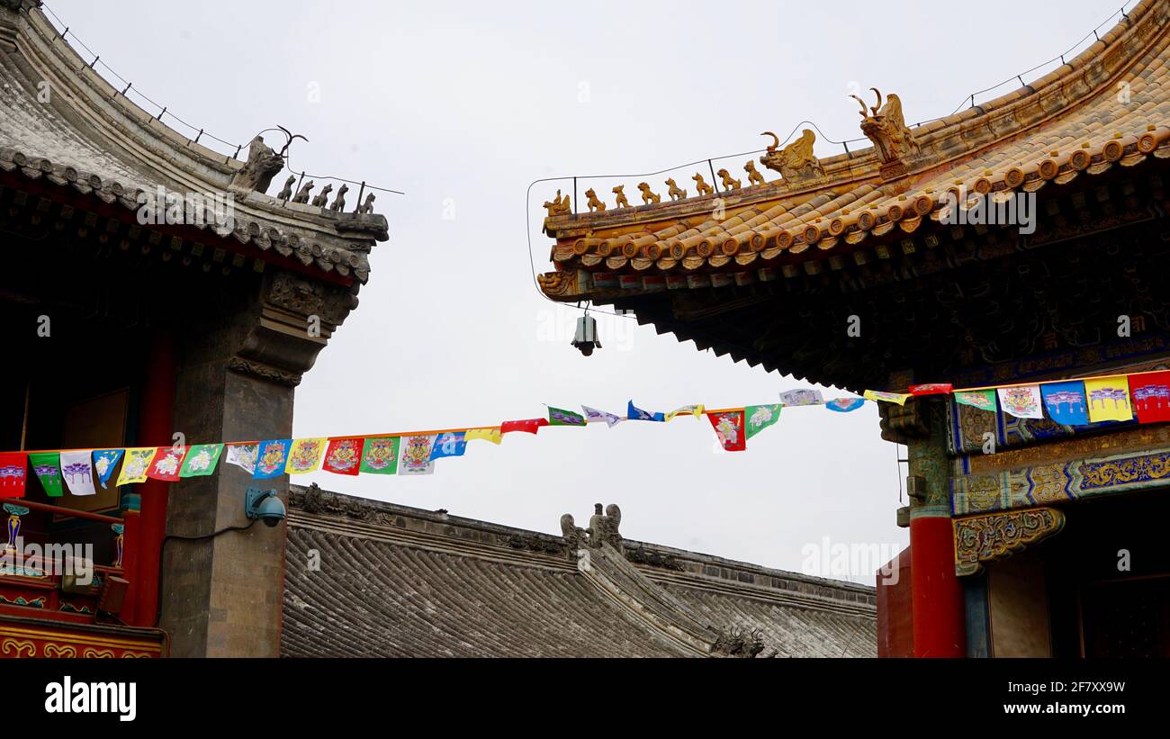 Corners of ancient China palace with colourful flags hanging and ...