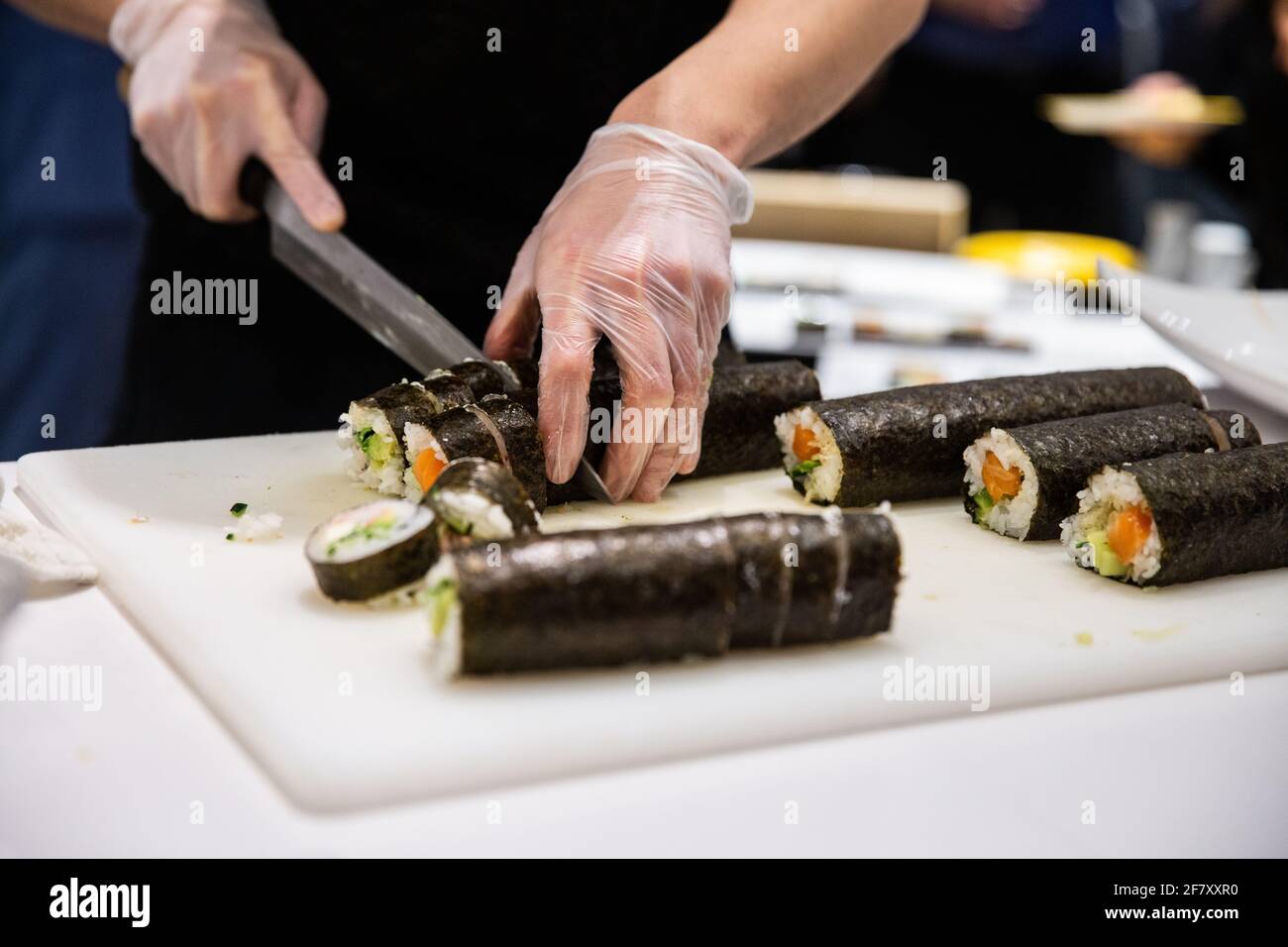 sushi being prepared by the chef in the kitchen Stock Photo - Alamy