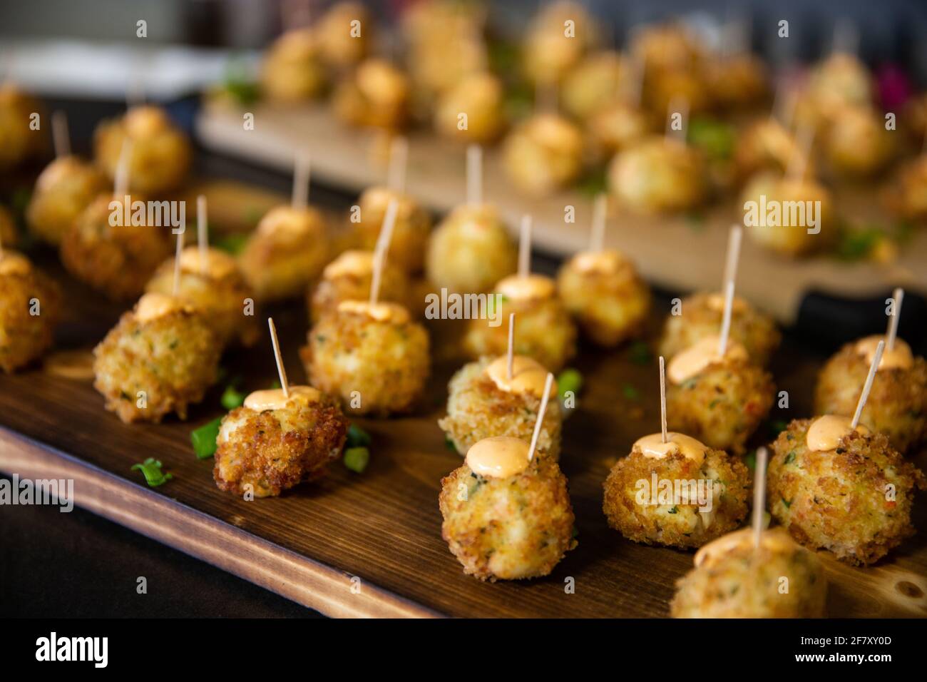 round finger food with sauce on a plate at a party Stock Photo - Alamy