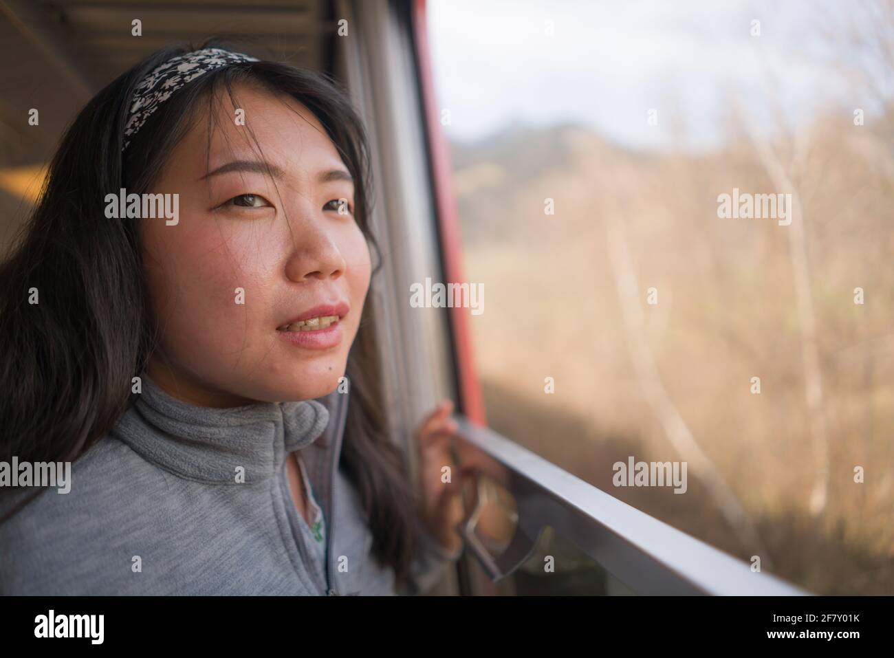 train travel getaway - lifestyle portrait of young happy and beautiful ...