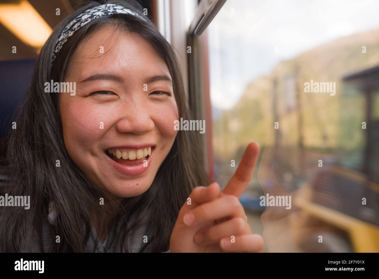 train travel getaway - lifestyle portrait of young happy and beautiful ...