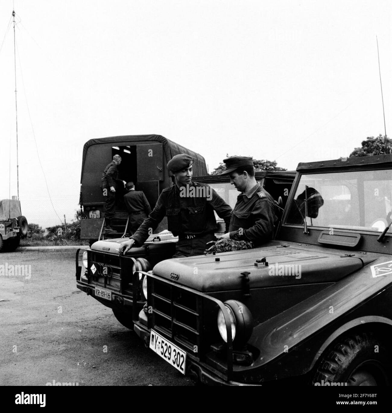A Dutch and German soldier talking to each other during exercises of ...