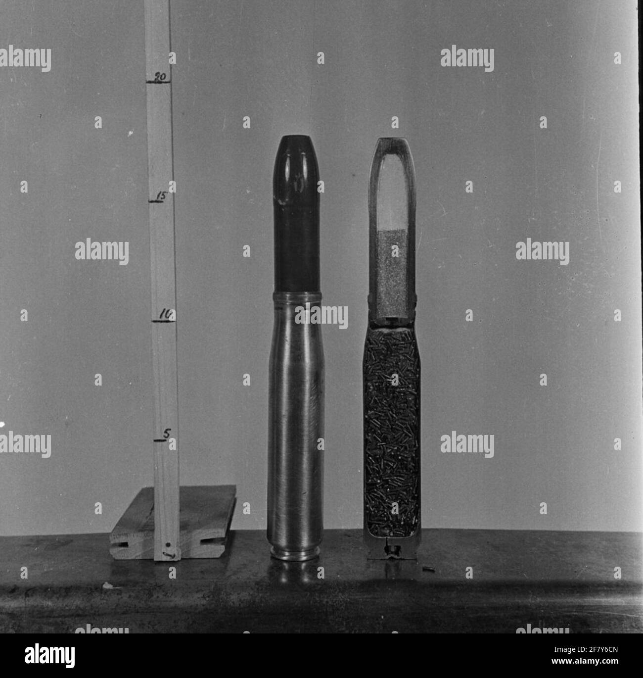 A complete 20 mm grenade with a cross-sectional view of the pushing and ...