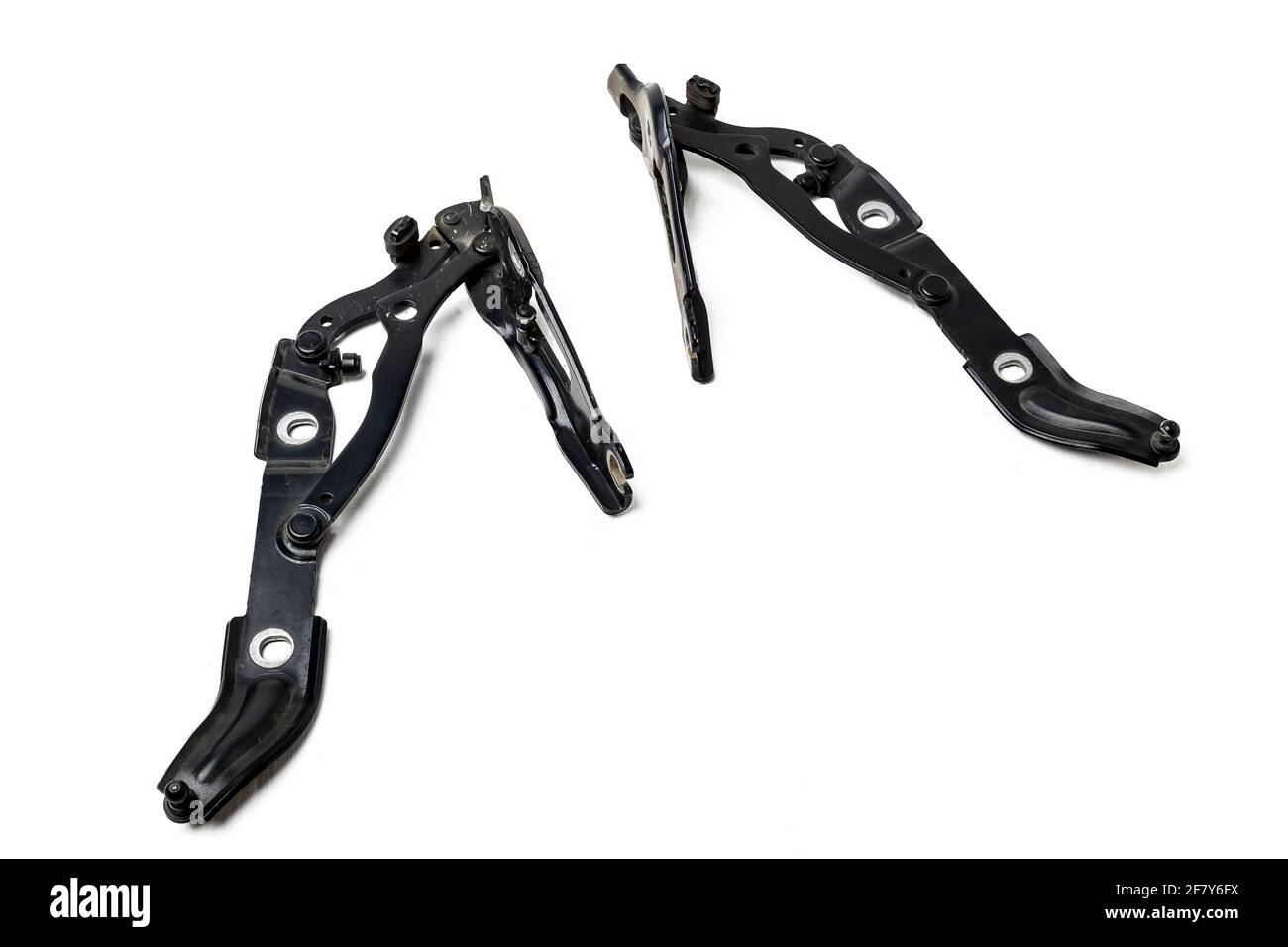 Pair of hinges for attaching the hood or trunk of the car on a white ...