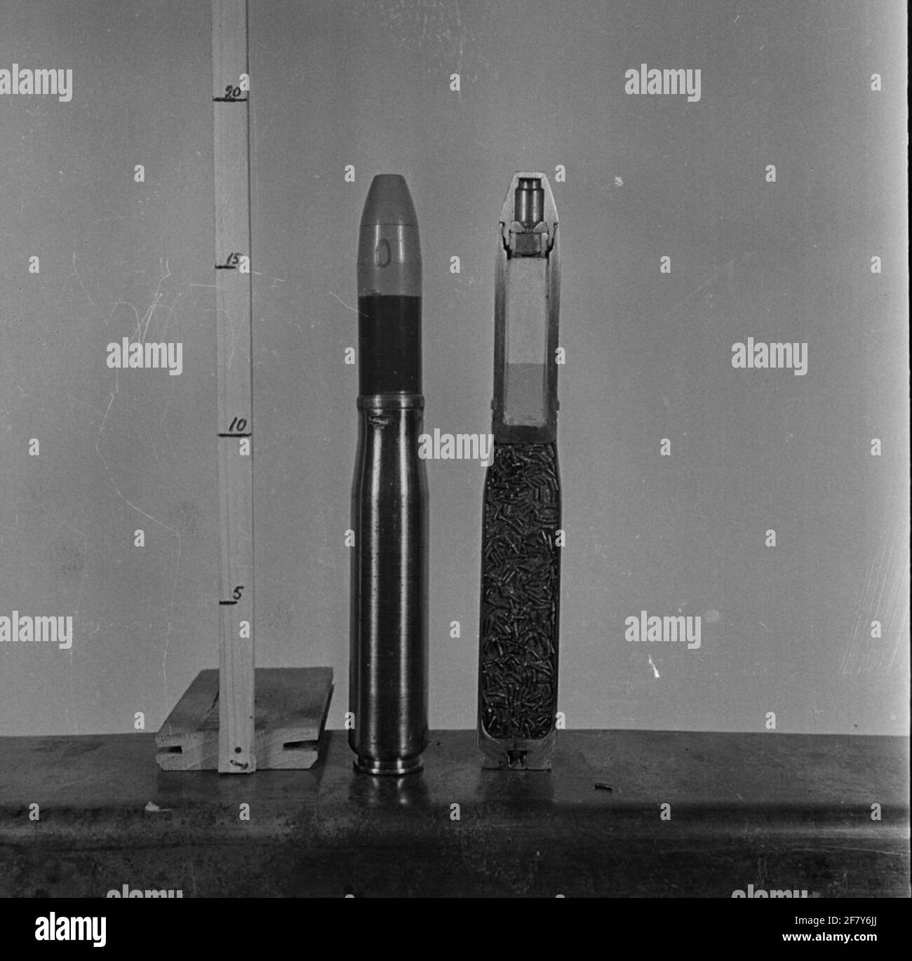 A complete 20 mm grenade with a cross-sectional view of the pushing and ...