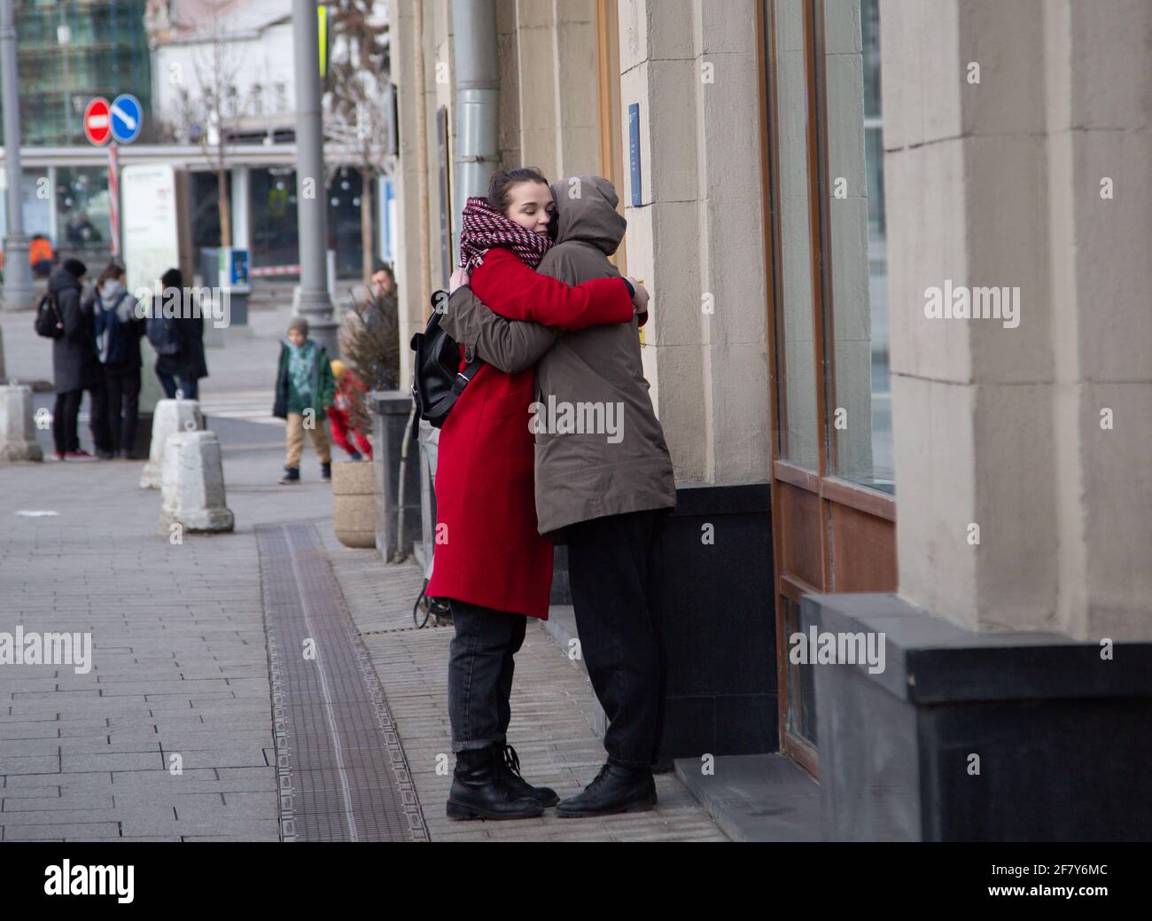 Girls cuddle in the street 2021 Stock Photo - Alamy