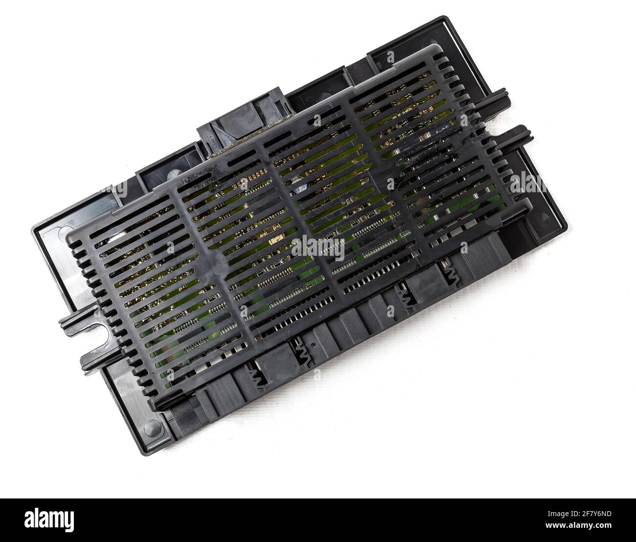 Plastic electronic control unit with black and blue connectors on a ...