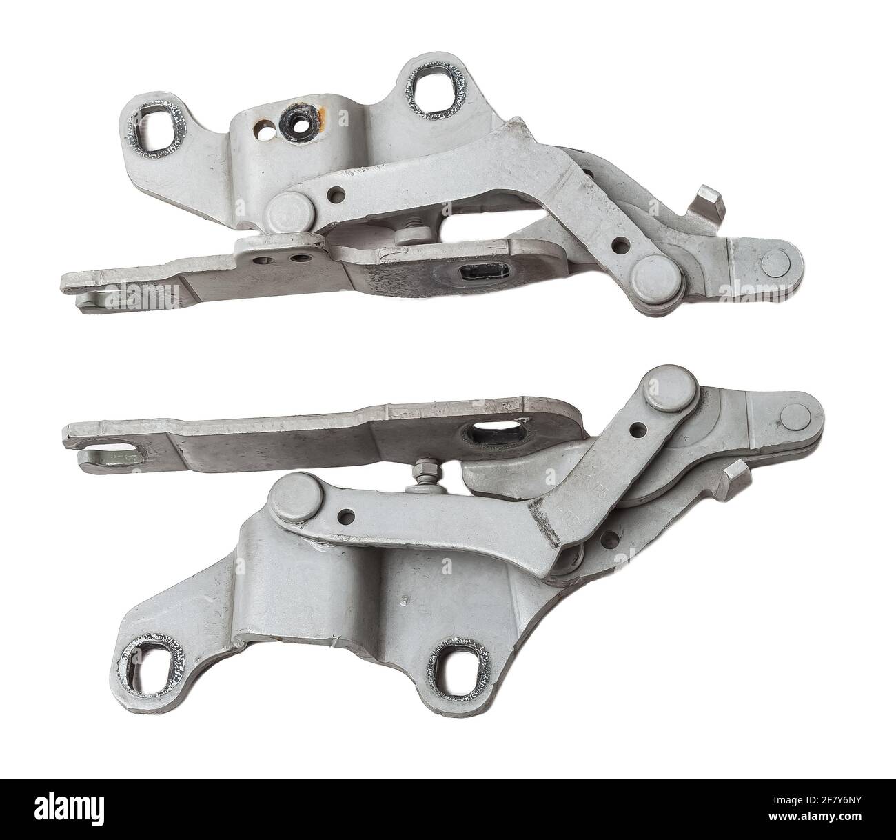 Pair of hinges for attaching the hood or trunk of the car on a white ...