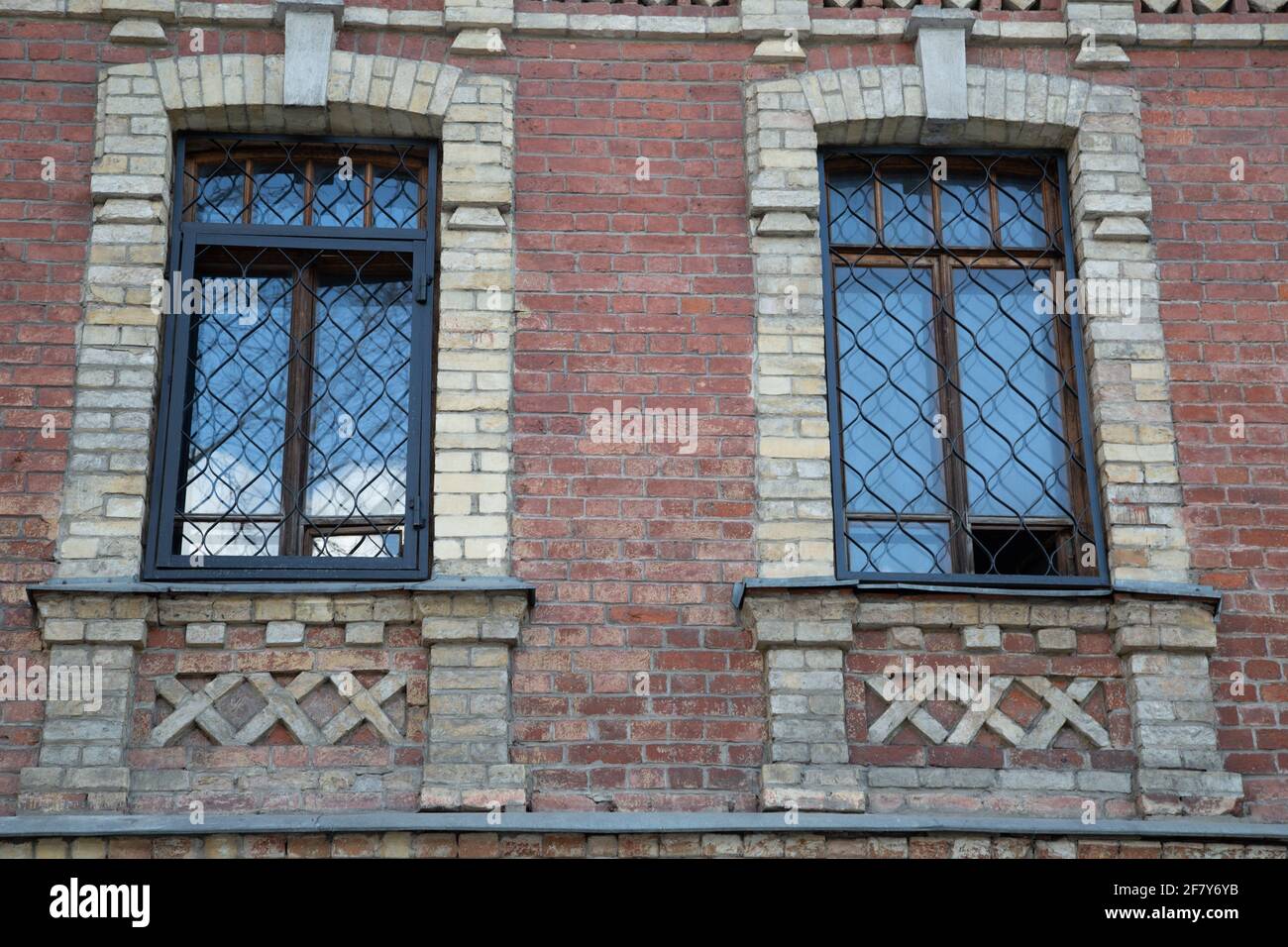 Windows in an old house with bars Stock Photo - Alamy