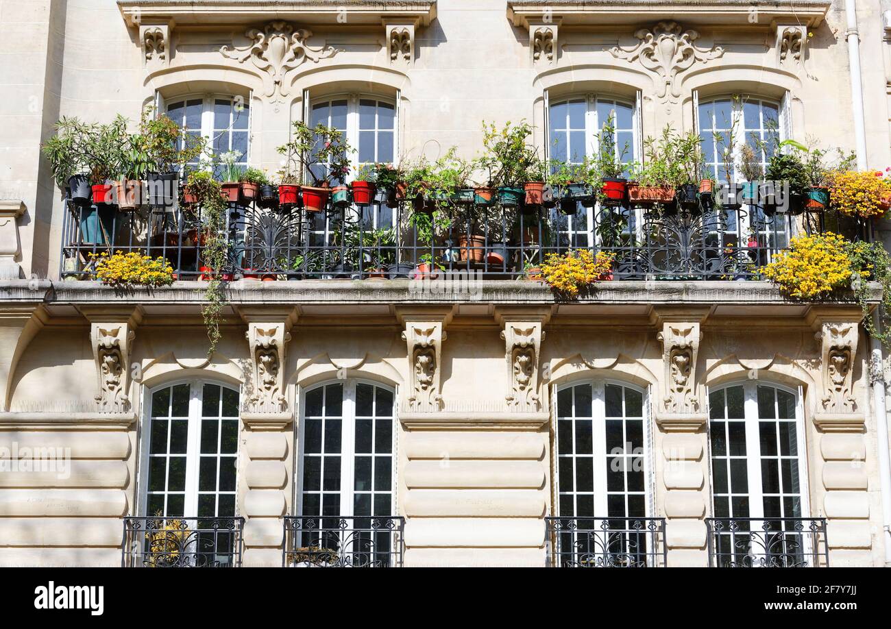 Traditional French house with typical balconies and windows. Paris ...