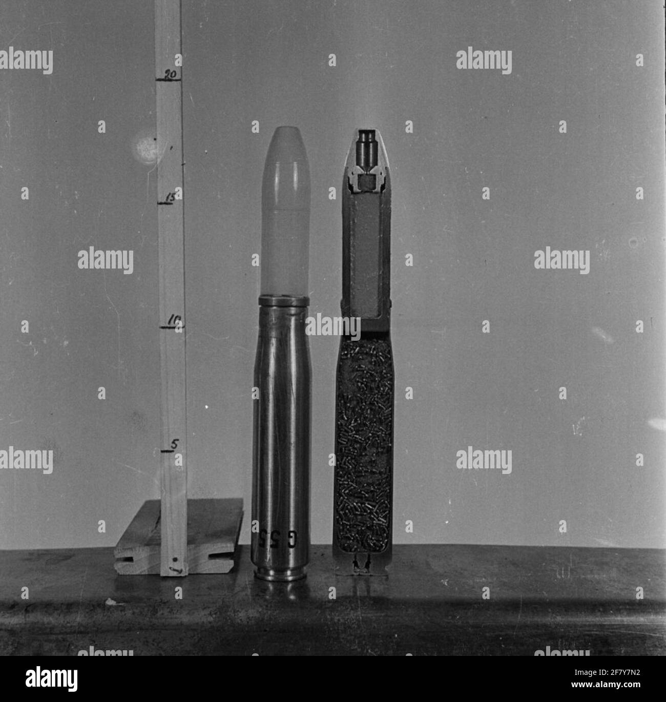 A complete 20 mm grenade with a cross-sectional view of the pushing and ...